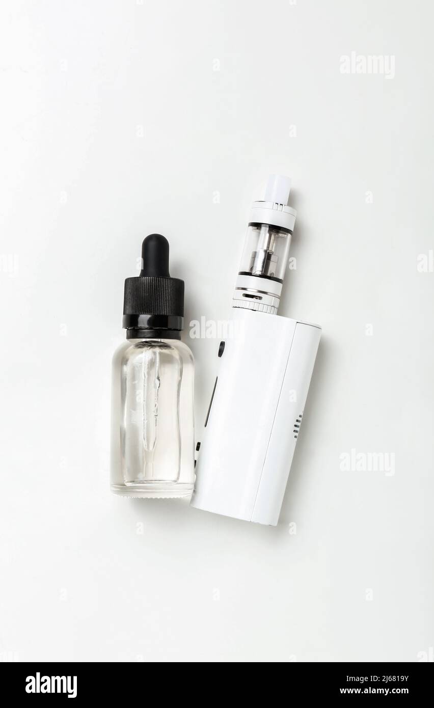 Modern vape mod and oil on white background Stock Photo - Alamy