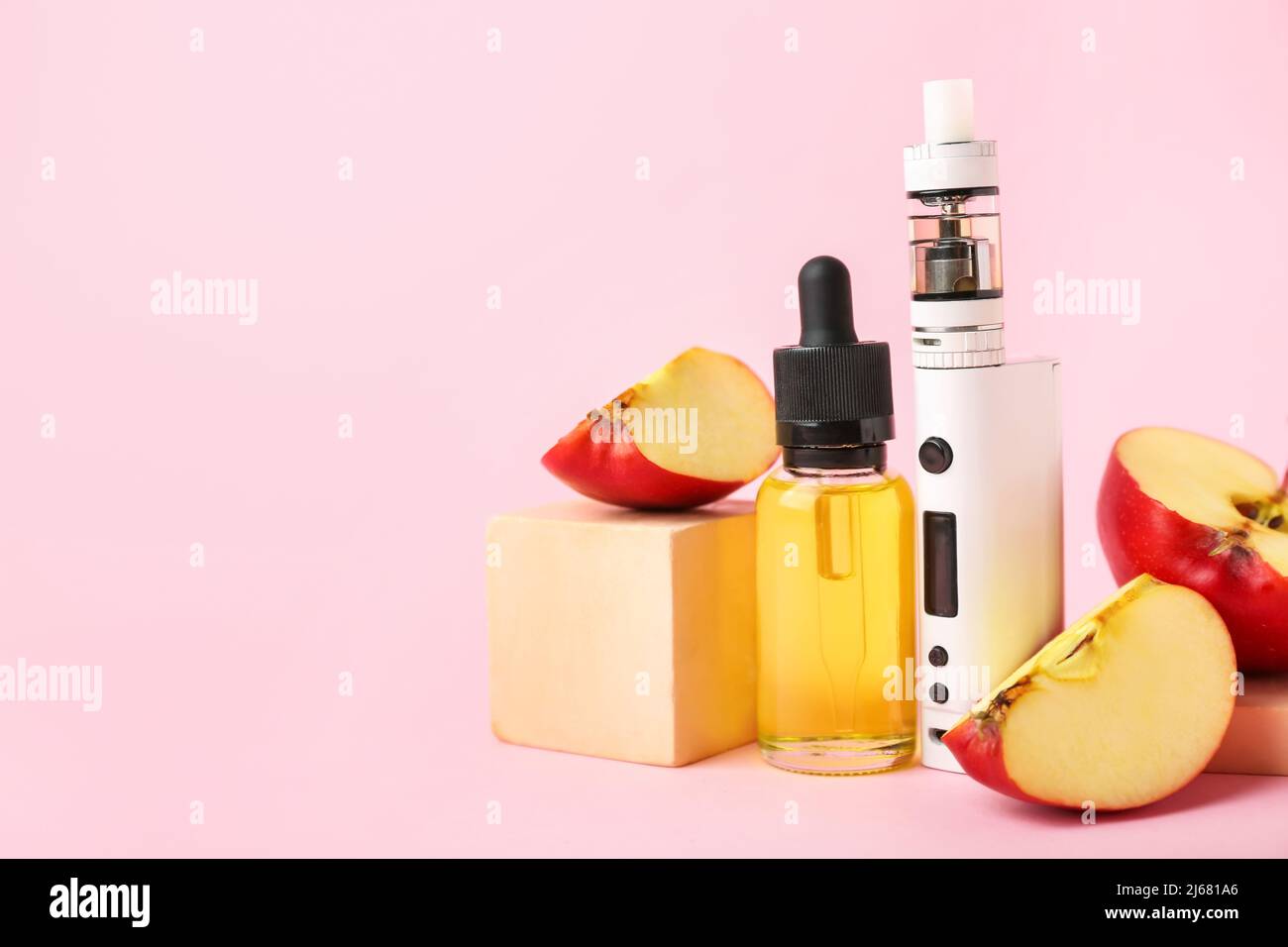 Modern vape mod, oil and apple on pink background Stock Photo - Alamy