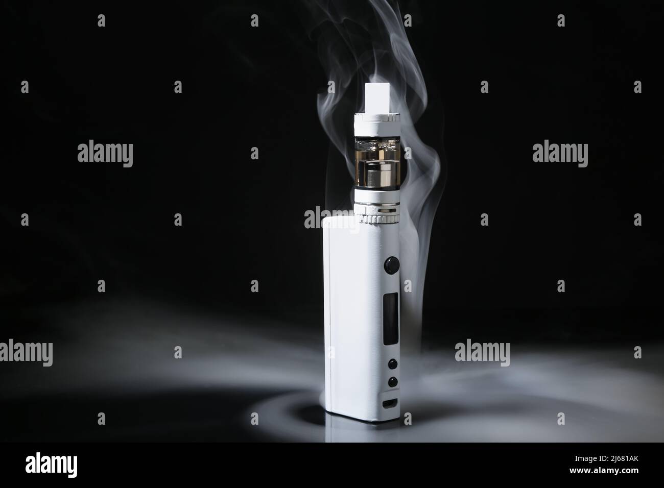 Modern vape mod and smoke on black background Stock Photo - Alamy