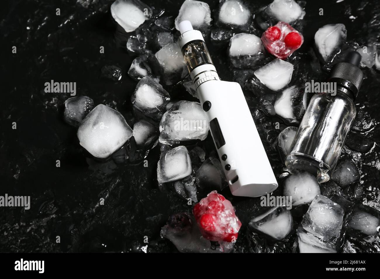 Modern vape mod, berries and ice cubes on black background Stock Photo ...