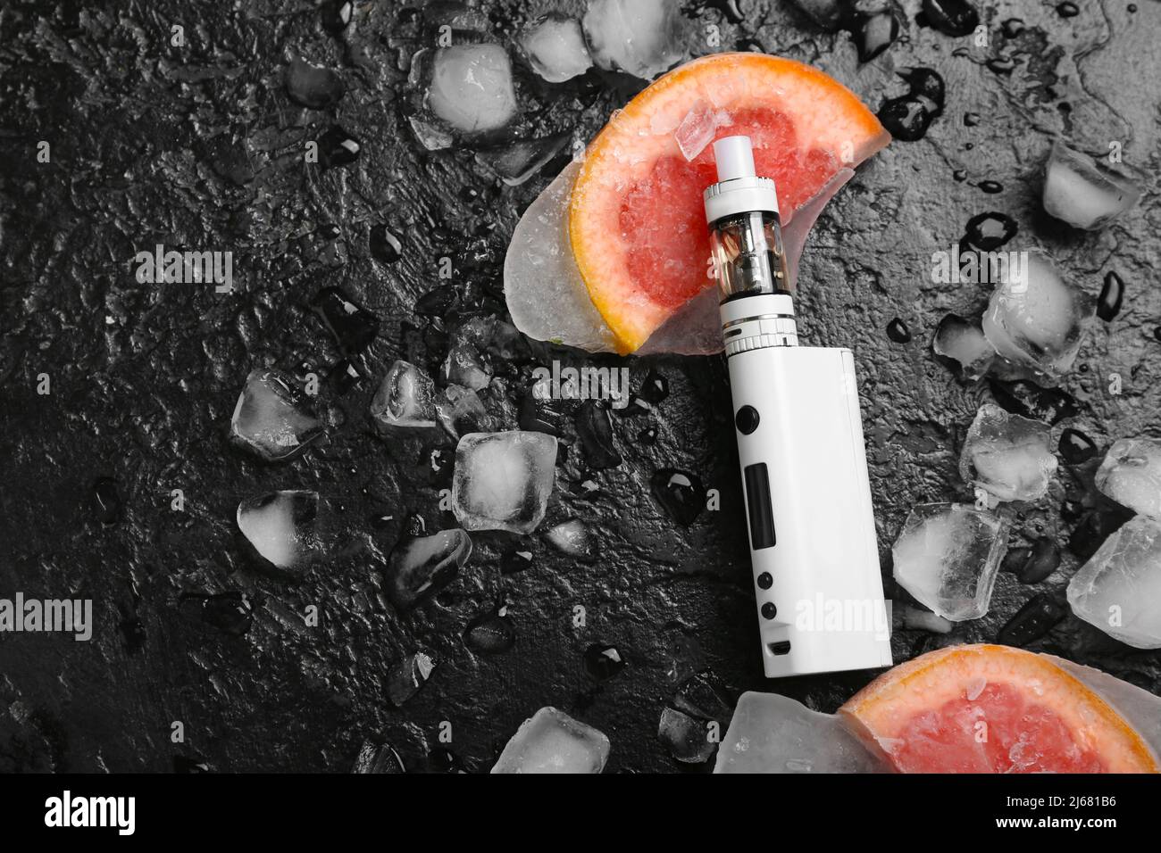 Modern vape mod, grapefruit and ice cubes on black background Stock ...