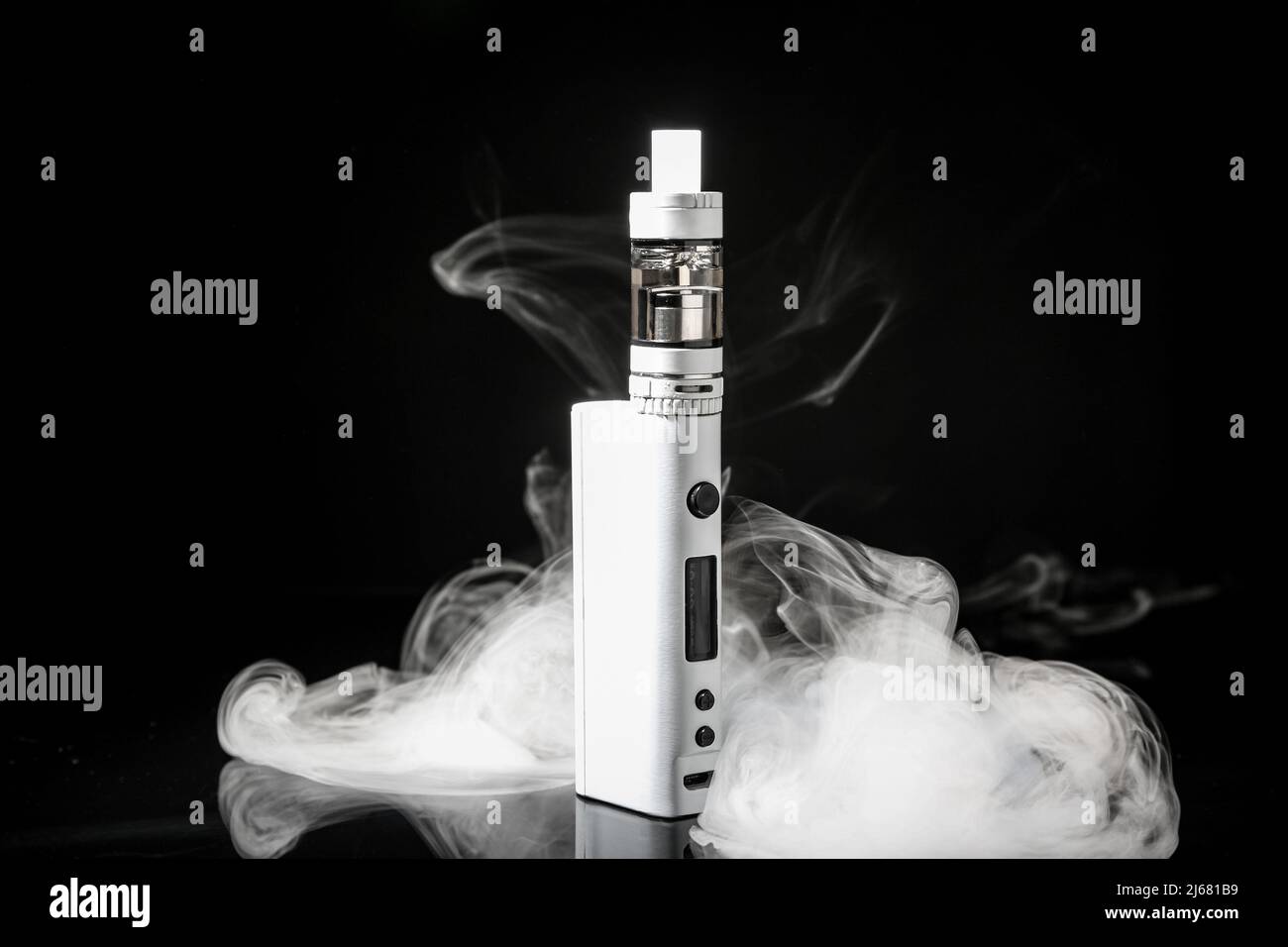 Modern vape mod and smoke on black background Stock Photo - Alamy