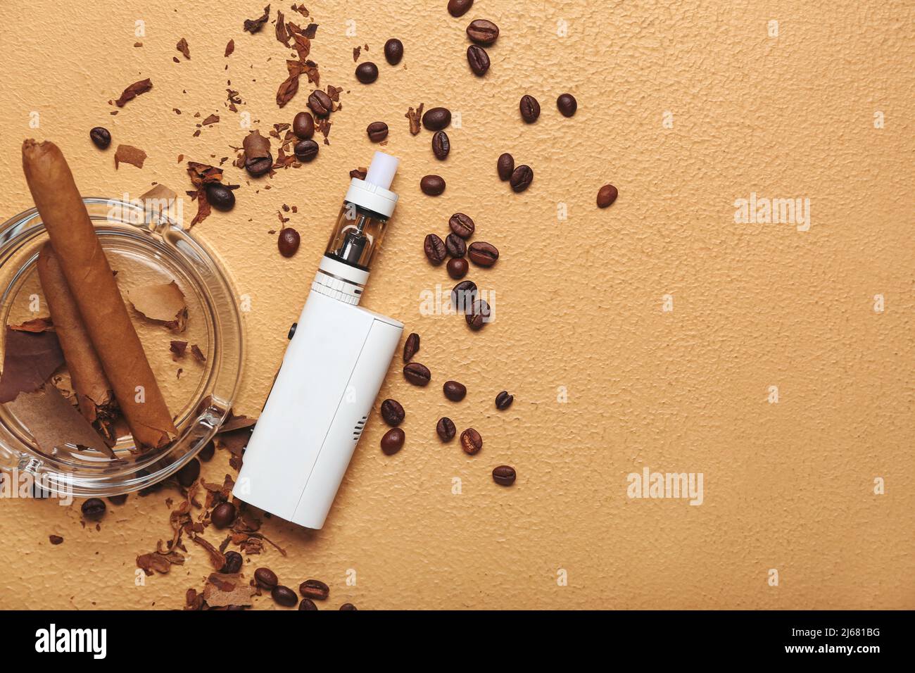 Modern vape mod, cigars and coffee beans on beige background Stock ...