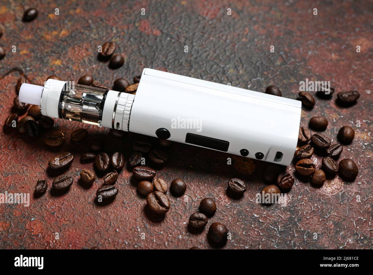 Modern vape mod and coffee beans on color background, closeup Stock ...