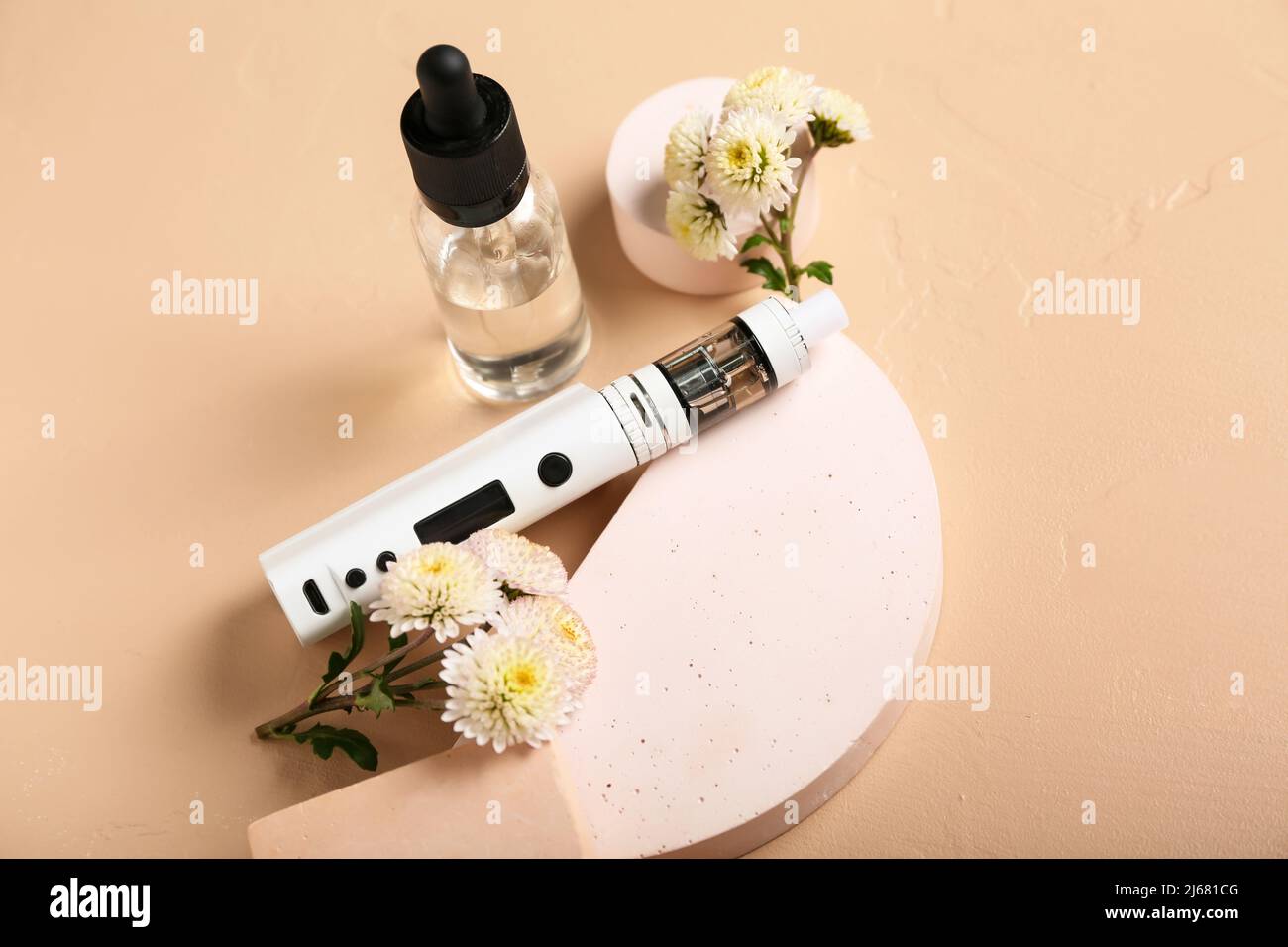 Modern vape mod, oil and flowers on beige background Stock Photo - Alamy