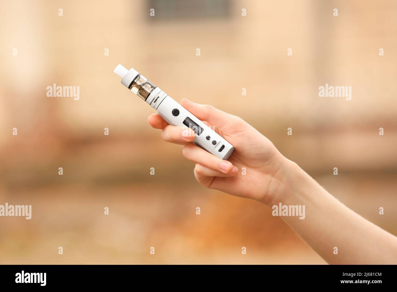 Female hand with modern vape mod outdoors Stock Photo - Alamy
