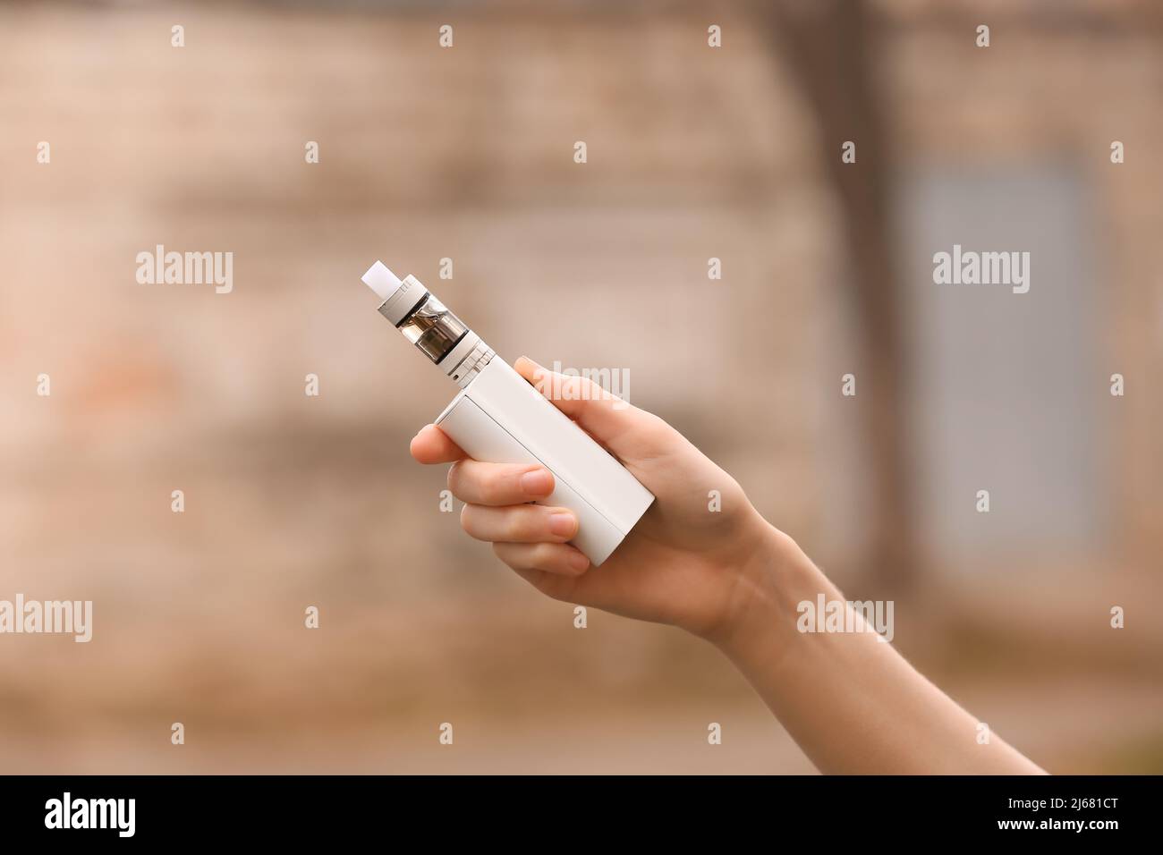 Female hand with modern vape mod outdoors Stock Photo - Alamy