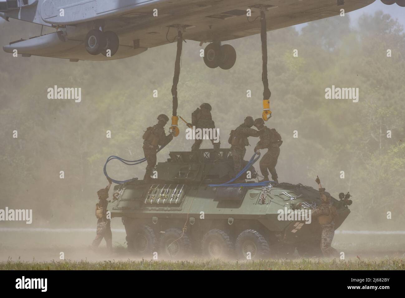 U.S. Marines with Combat Logistics Battalion (CLB) 24 attach a Light ...