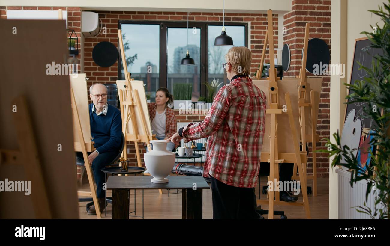 Multiethnic group of people attending art class lesson to learn new ...