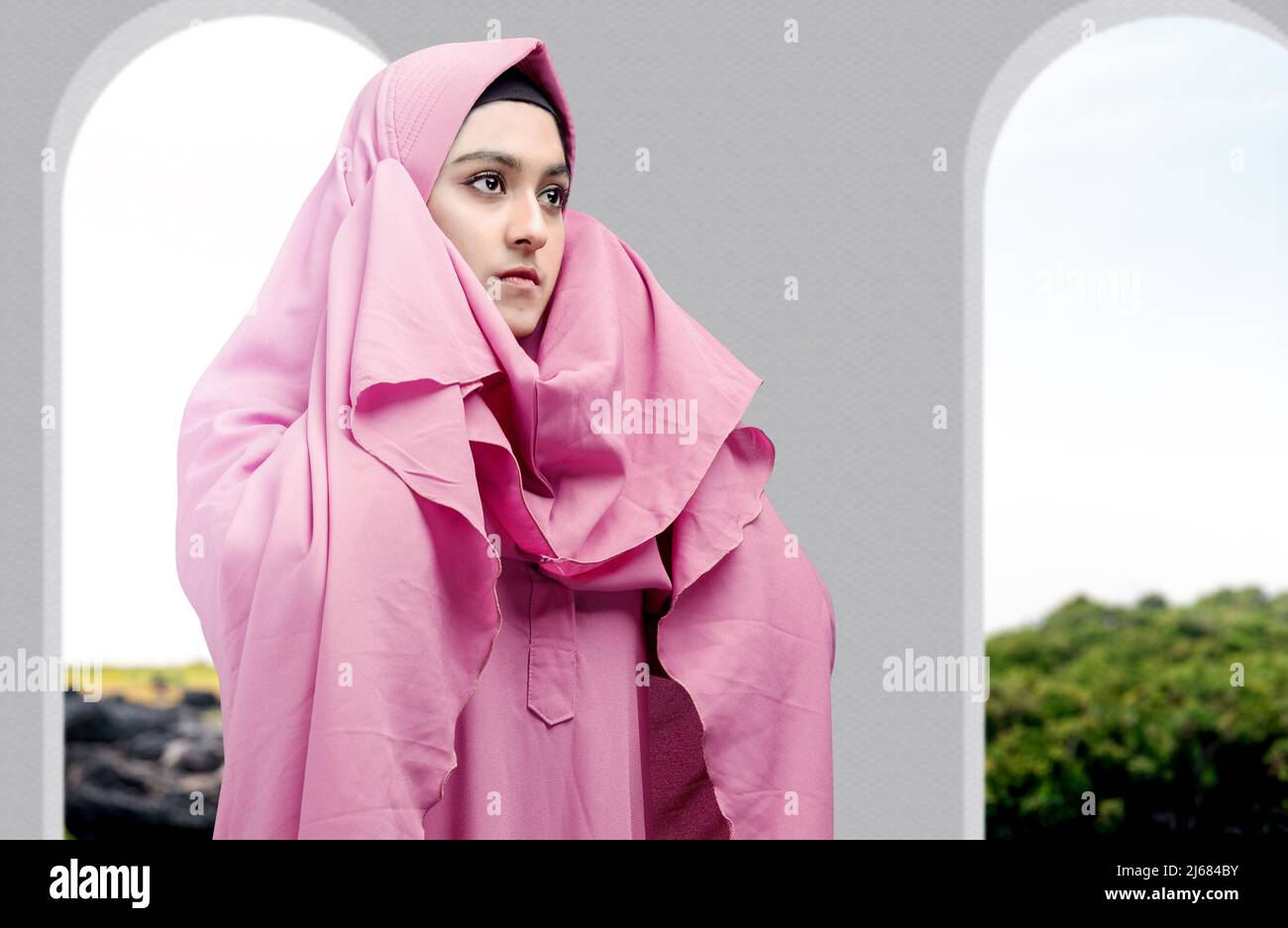 Asian Muslim woman in veil in praying position (salat) on the mosque ...