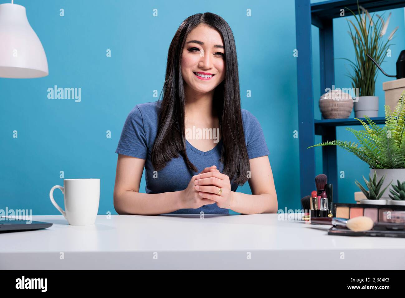 Attractive vlogger sitting studio desk hi-res stock photography and ...