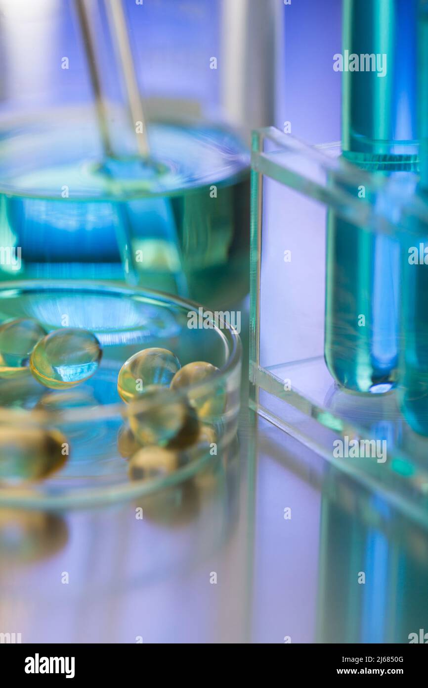 Glass dish containing soft capsules in a chemistry LABS - stock photo ...