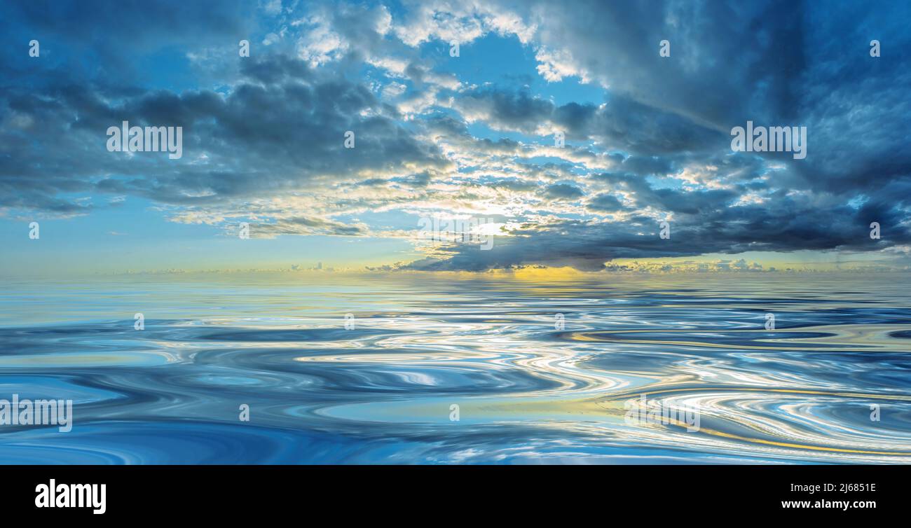 Storm clouds reflected on smooth cold water Stock Photo - Alamy