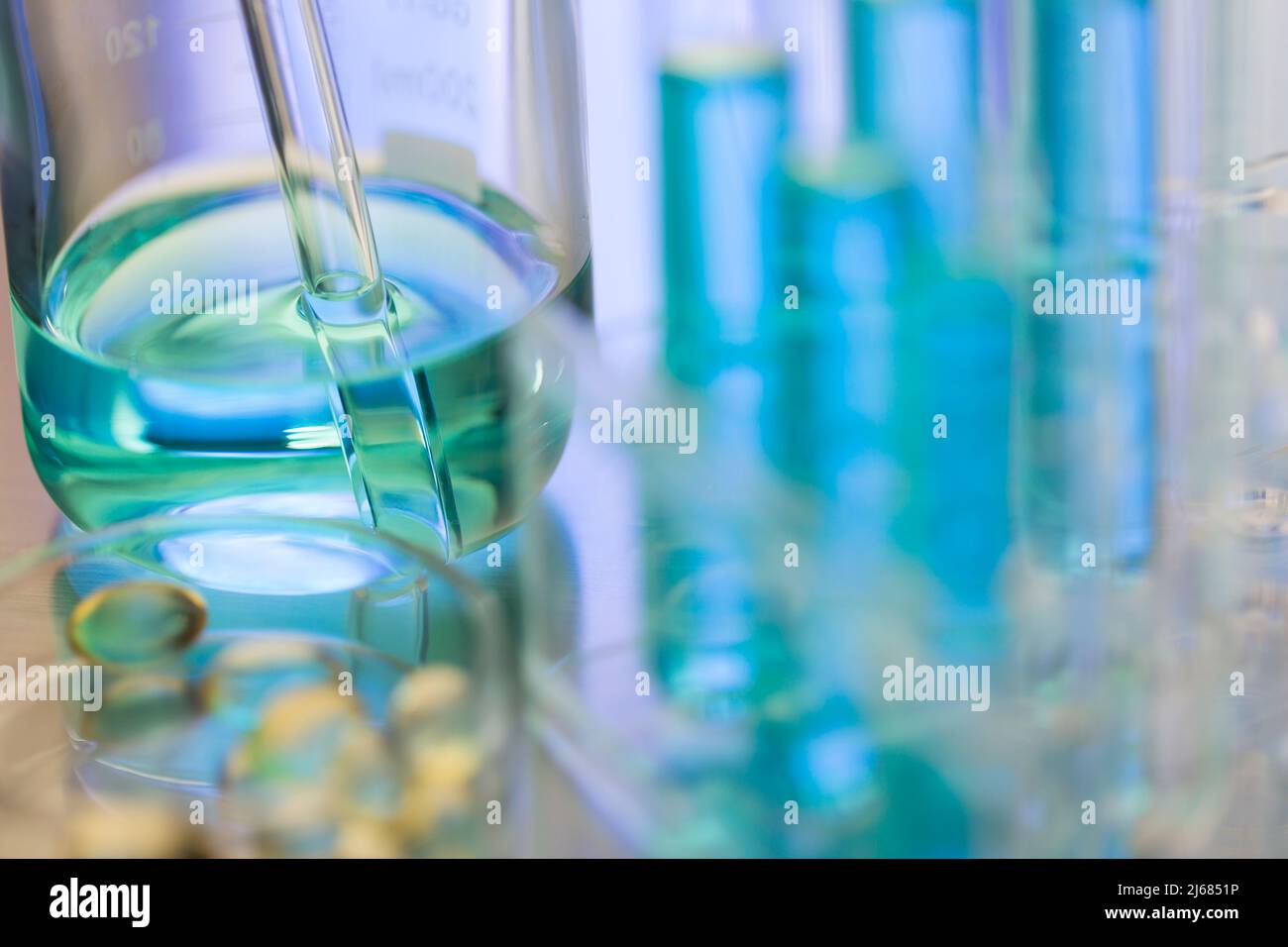 Blue chemical reagent in the beaker with glass pipe - stock photo Stock ...