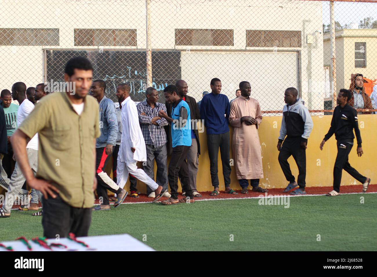 Prison inmates line up to watch the cup crowning in the inmates ...