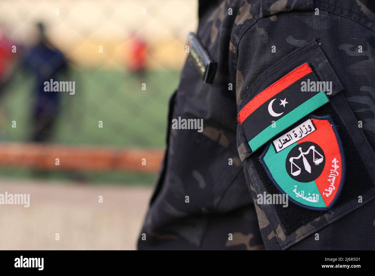The logo of the judicial police in Libya appears guarding the prison as ...