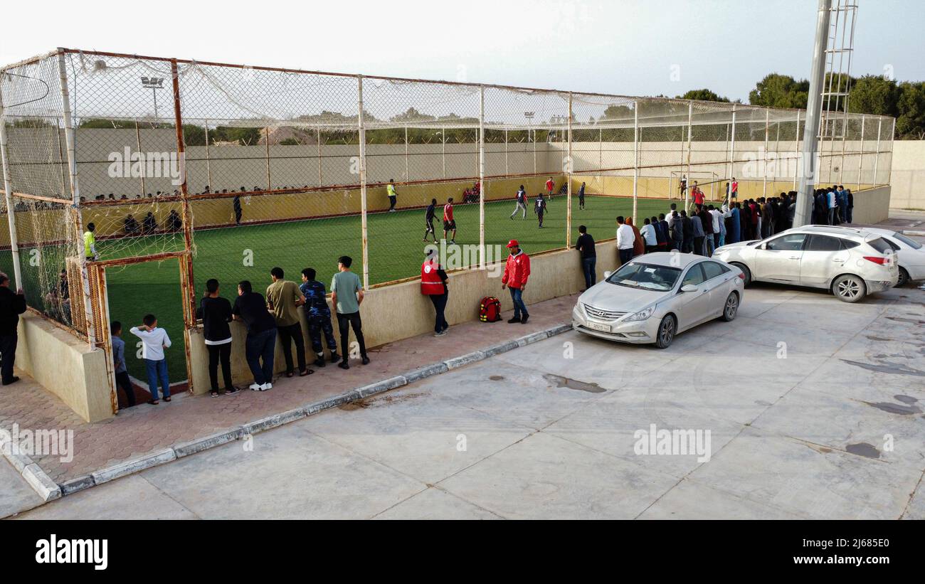 A scene showing the inmates watching the match between the Libyan and ...