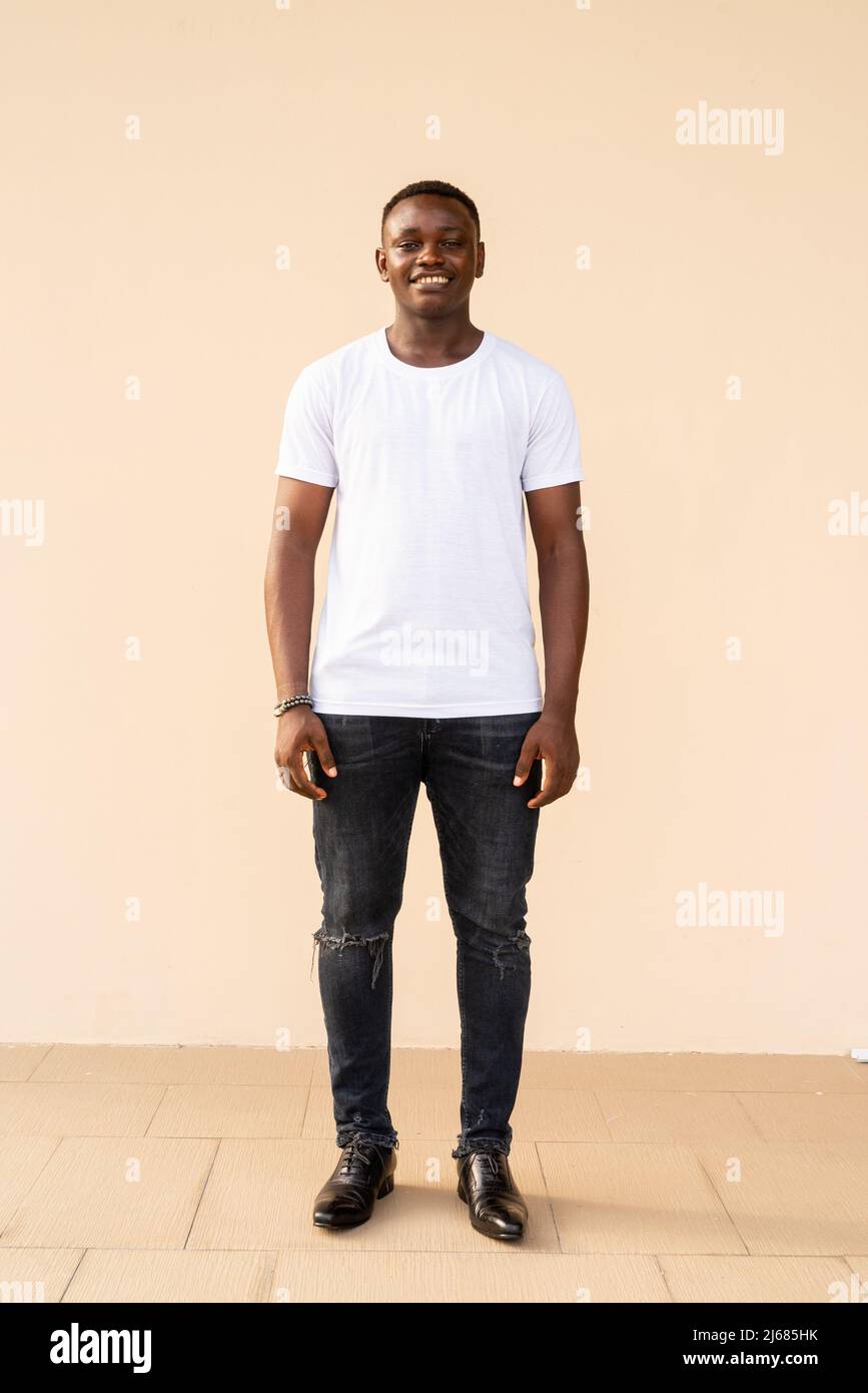Full length portrait of handsome young African man Stock Photo - Alamy