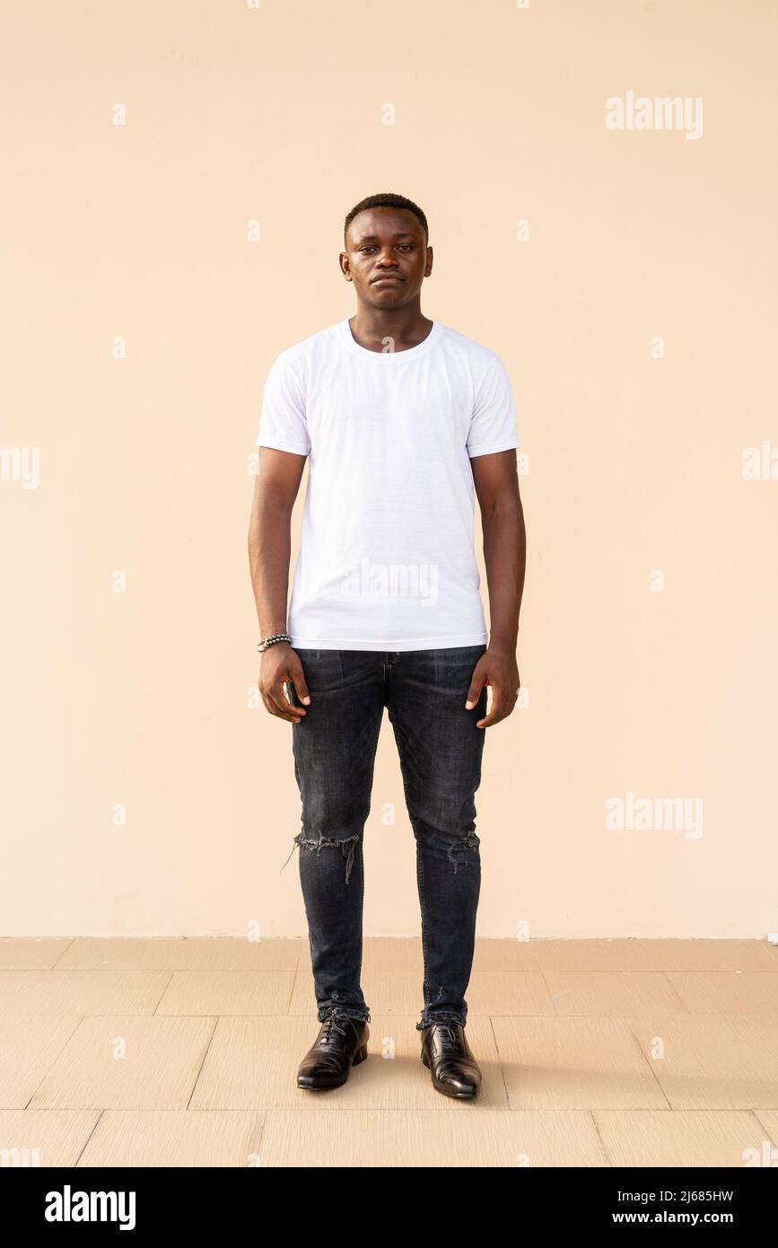 Full length portrait of handsome young African man Stock Photo - Alamy