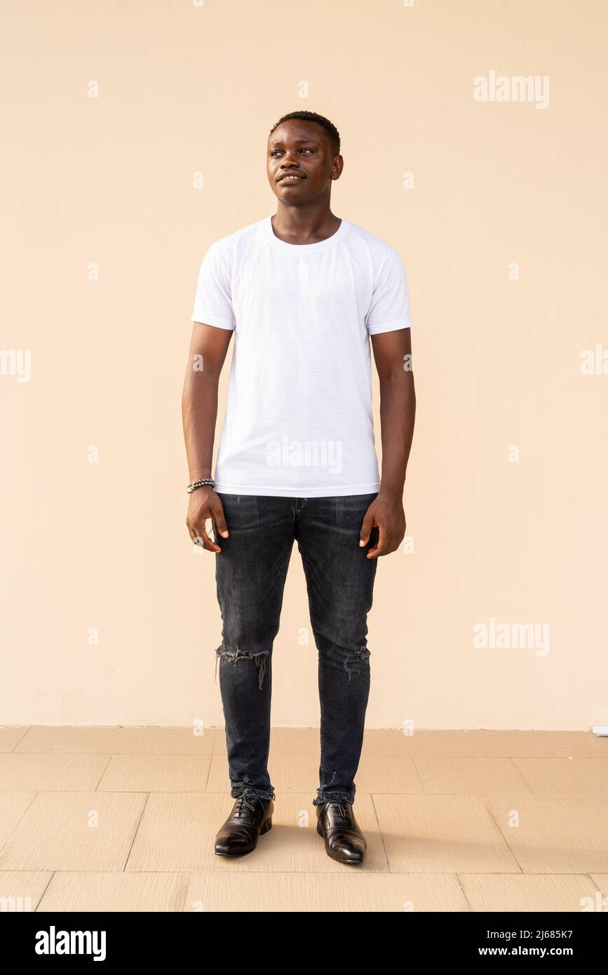 Full length portrait of handsome young African man Stock Photo - Alamy