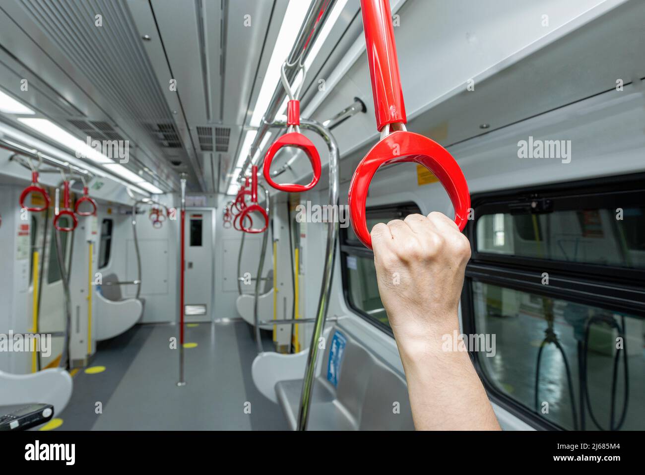 Passenger hand holding handle on the train for safety Stock Photo - Alamy