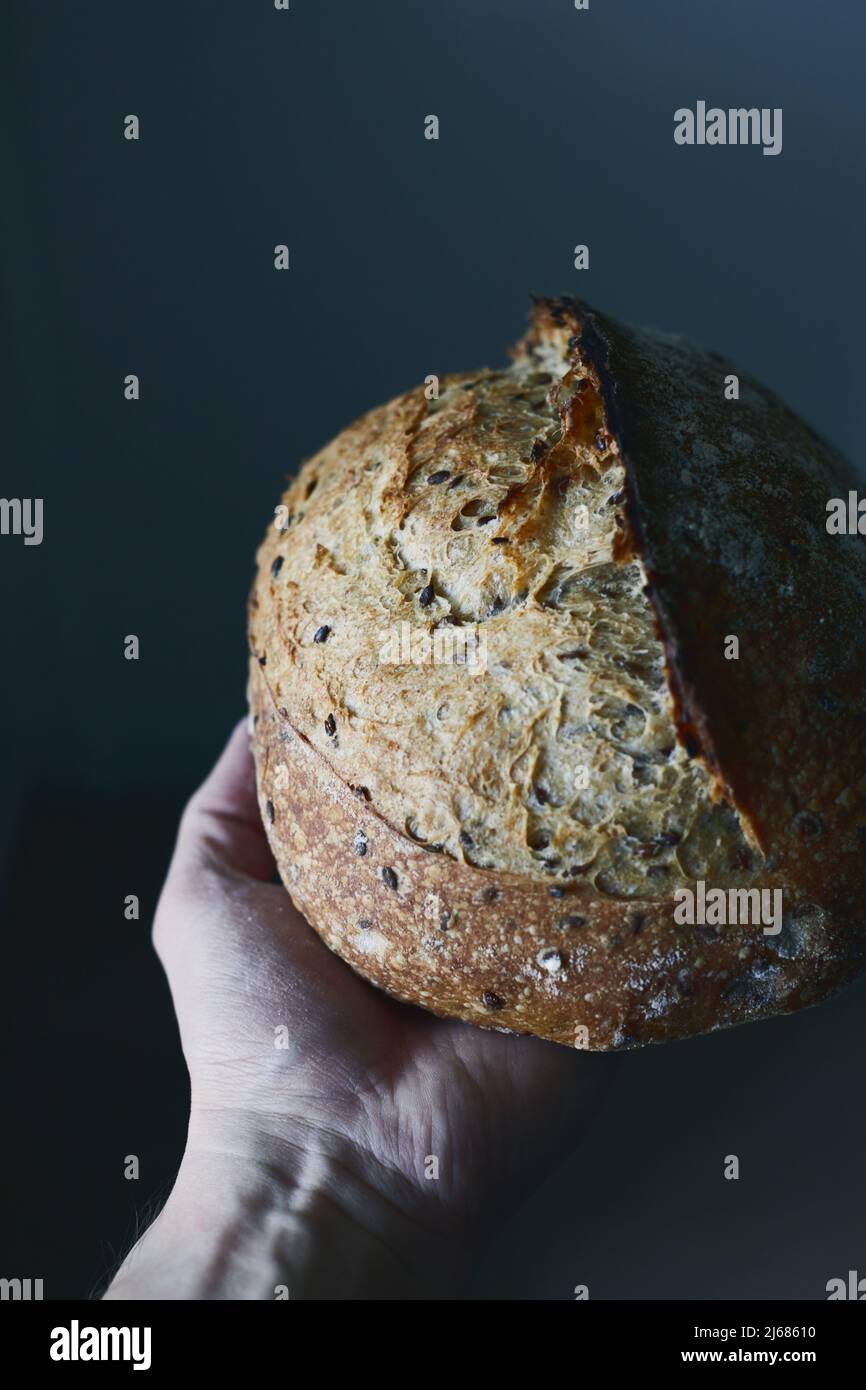 Homemade wheat bread with flax seeds. The concept of homemade bread and ...