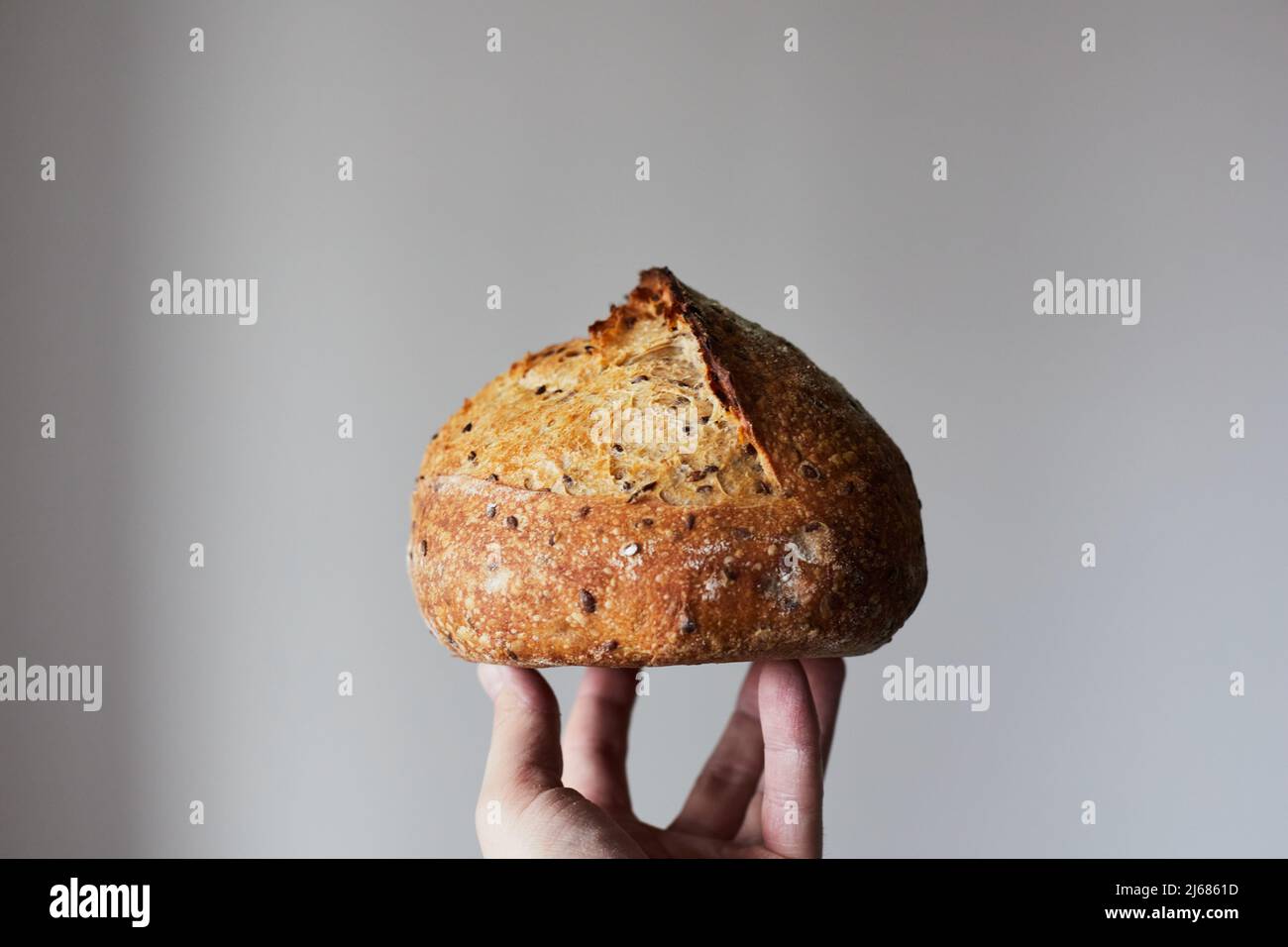 Homemade wheat bread with flax seeds. The concept of homemade bread and ...