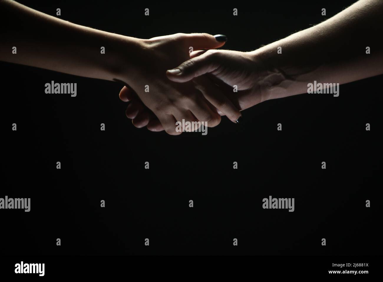 Handshake between the two partners. Rescue or helping gesture of hands ...