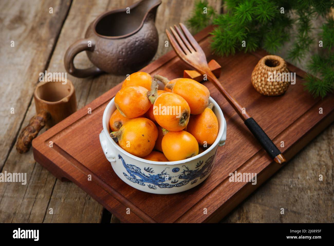 Eating loquat fruit hi-res stock photography and images - Alamy
