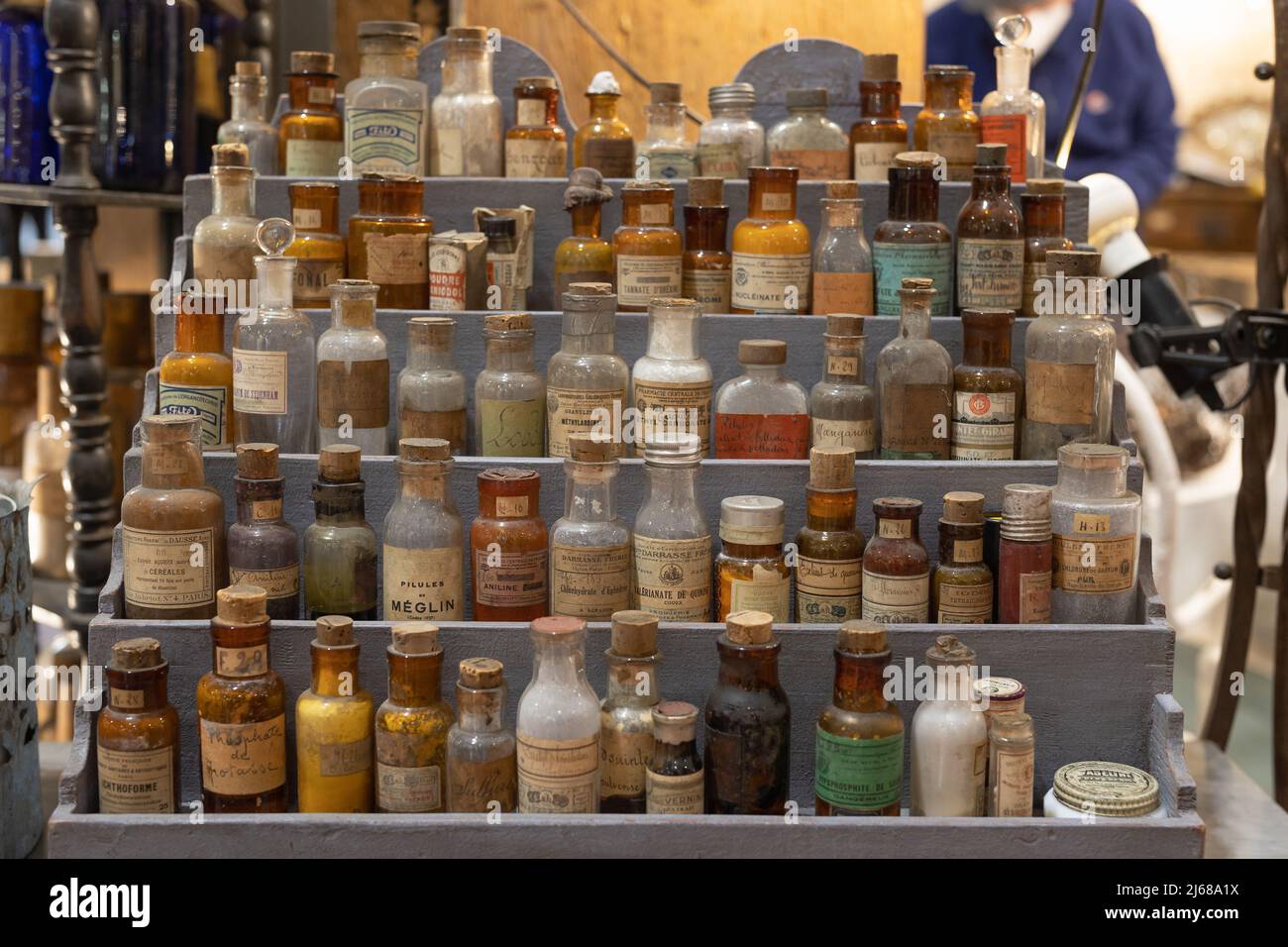 Antique Glass Bottles Containing Chemical Compounds on a Wooden Display ...