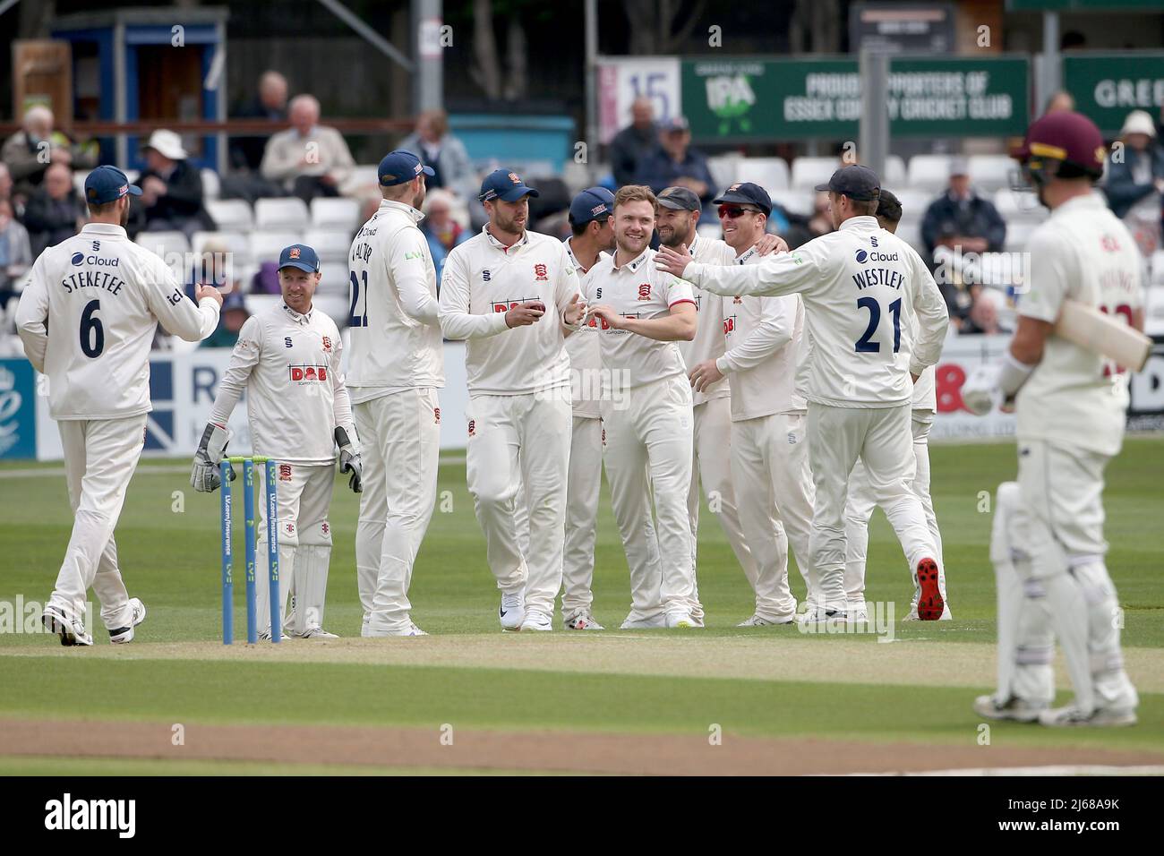 Sam Cook of Essex celebrates with his team mates after taking the ...