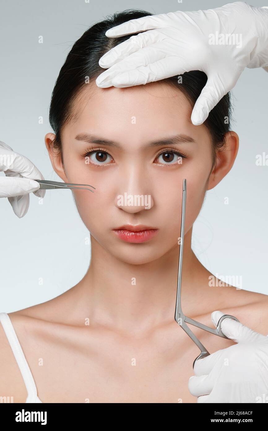 Young women have plastic surgery Stock Photo - Alamy