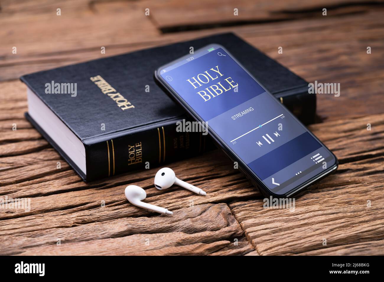 Hearing Bible Music On Phone. Christian Studying Stock Photo - Alamy
