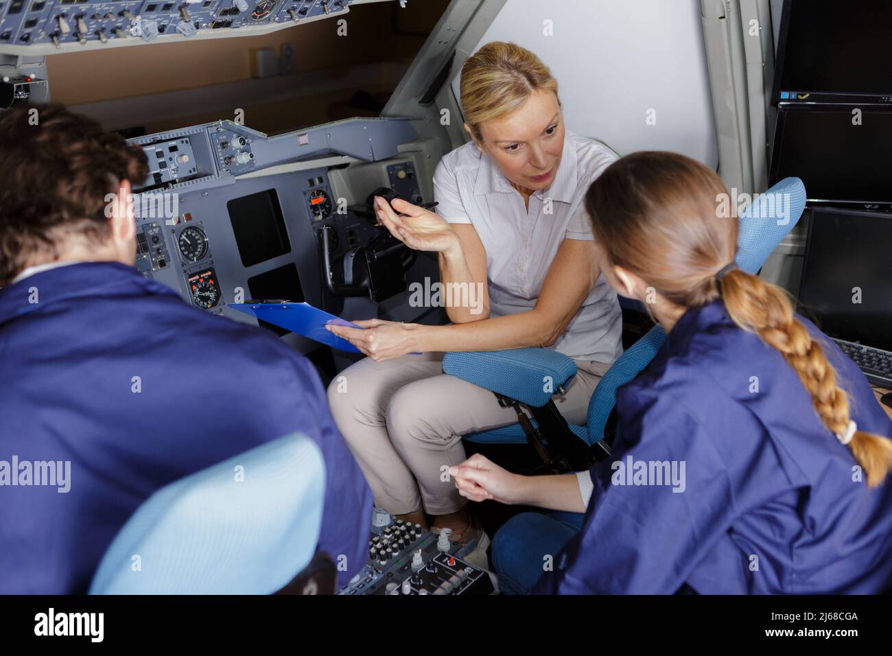 teacher and students in aircraft cockpit Stock Photo - Alamy