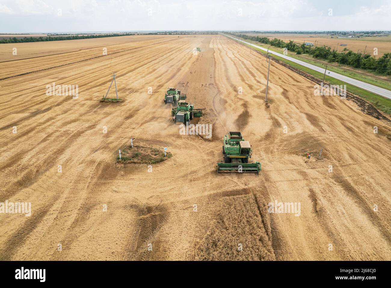 Combine harvesting: aerial view of agricultural machine collecting ...