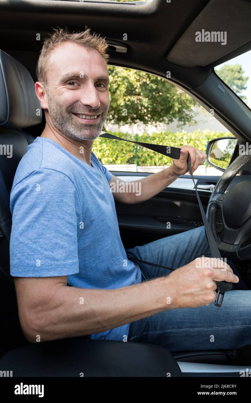 portrait of an handsome happy business man driving his car Stock Photo ...