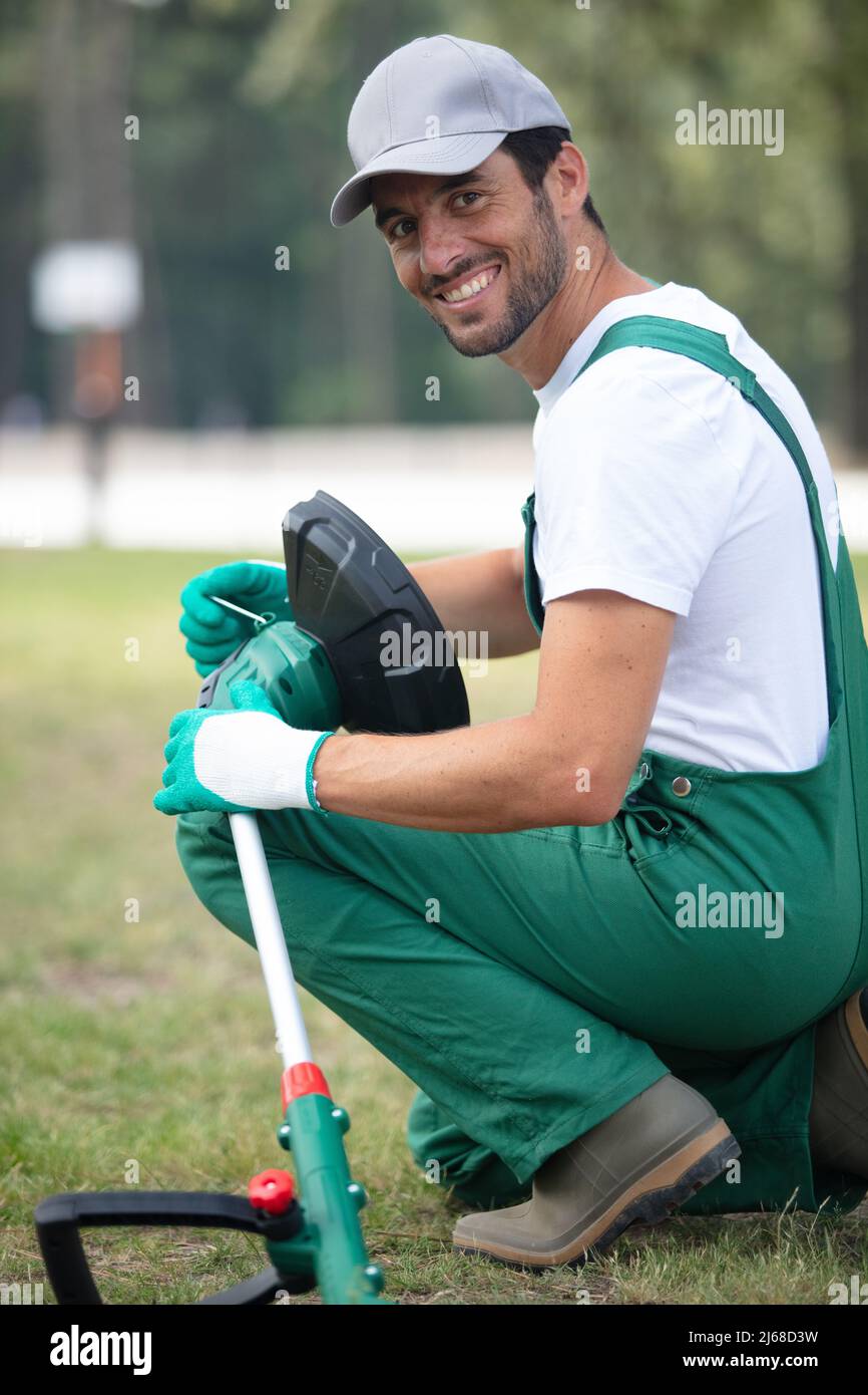 happy gardener smiling at the camera Stock Photo - Alamy