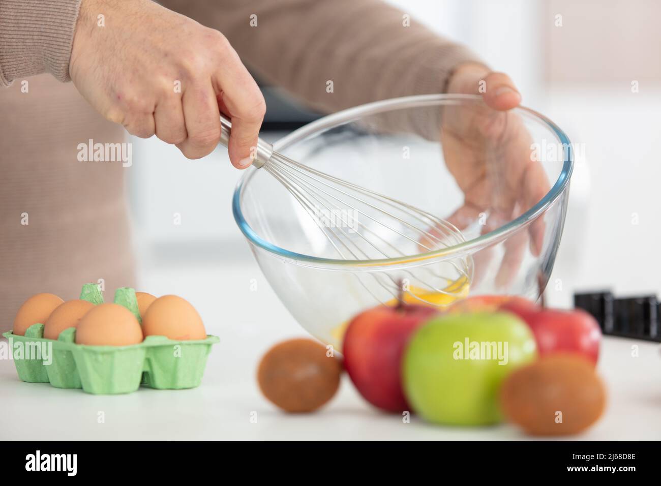 lose up of male hand mixing ingredients at home Stock Photo - Alamy