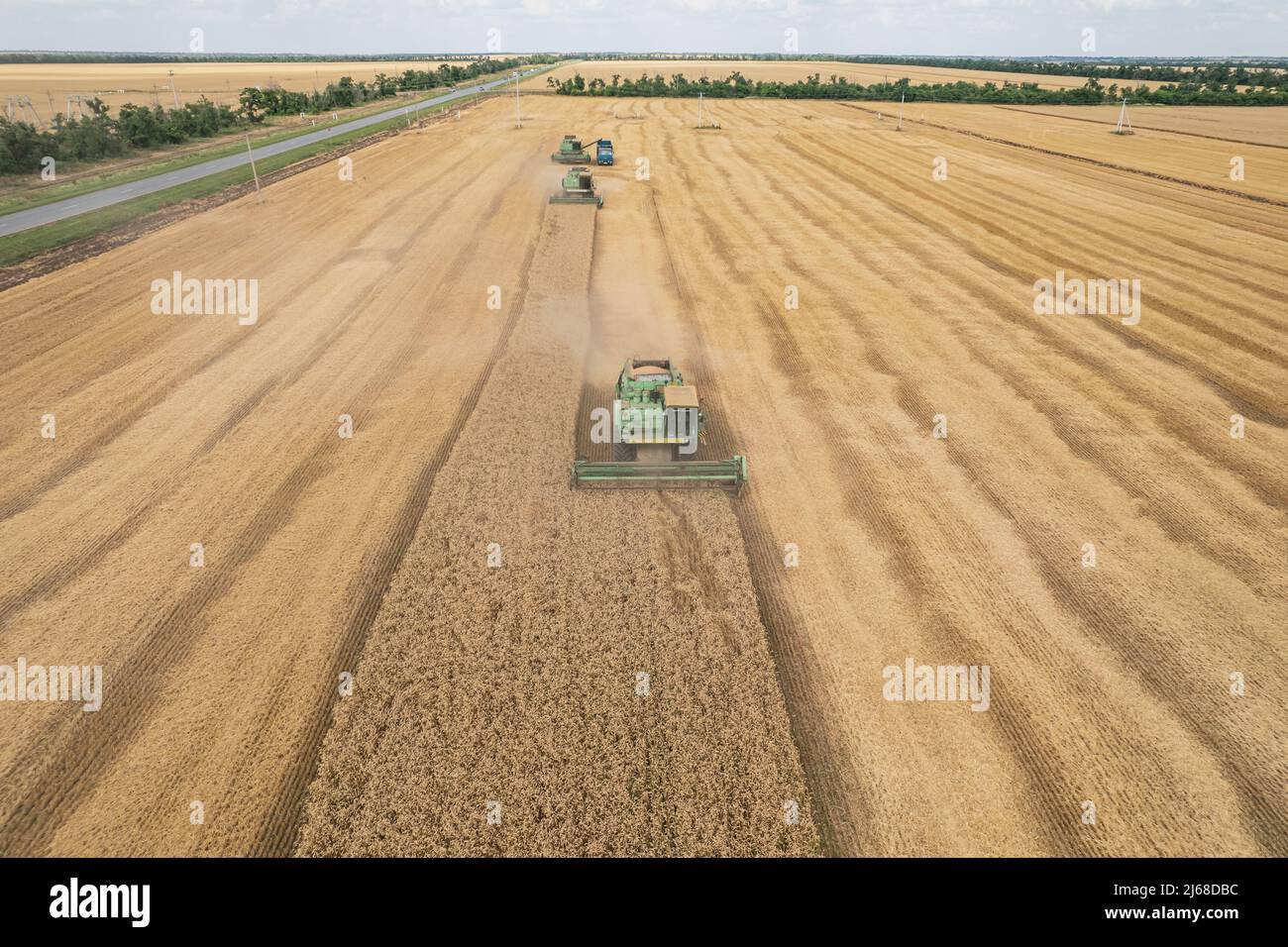 Combine harvesting: aerial view of agricultural machine collecting ...