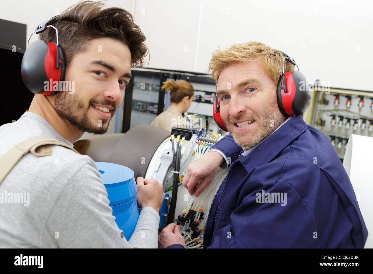 two men in the production of electronic devices Stock Photo - Alamy