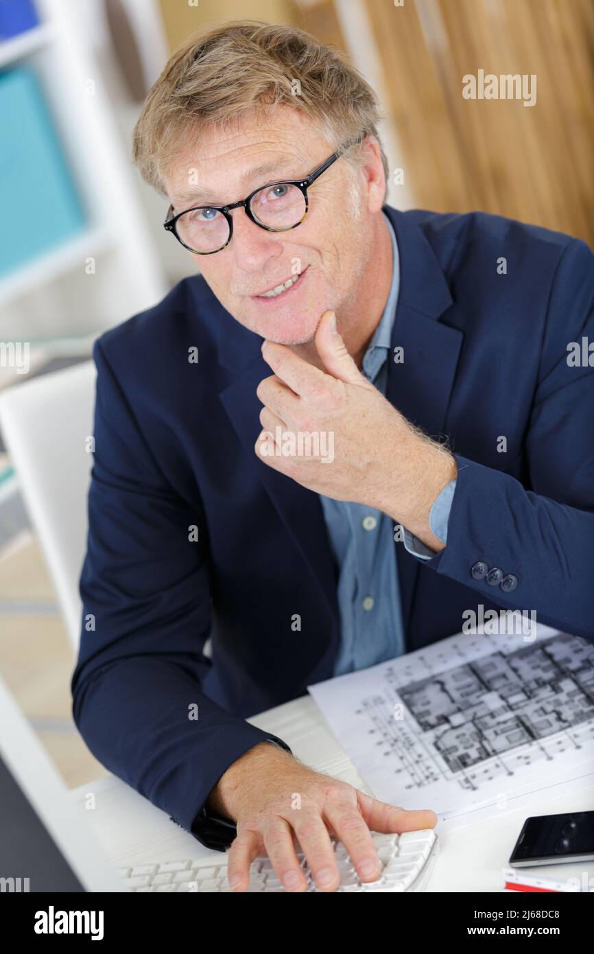 mature architect looking at camera Stock Photo - Alamy