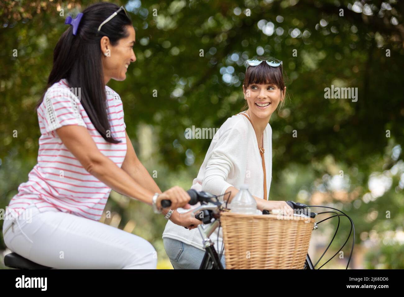 Asian girls riding bicycle hi-res stock photography and images - Alamy