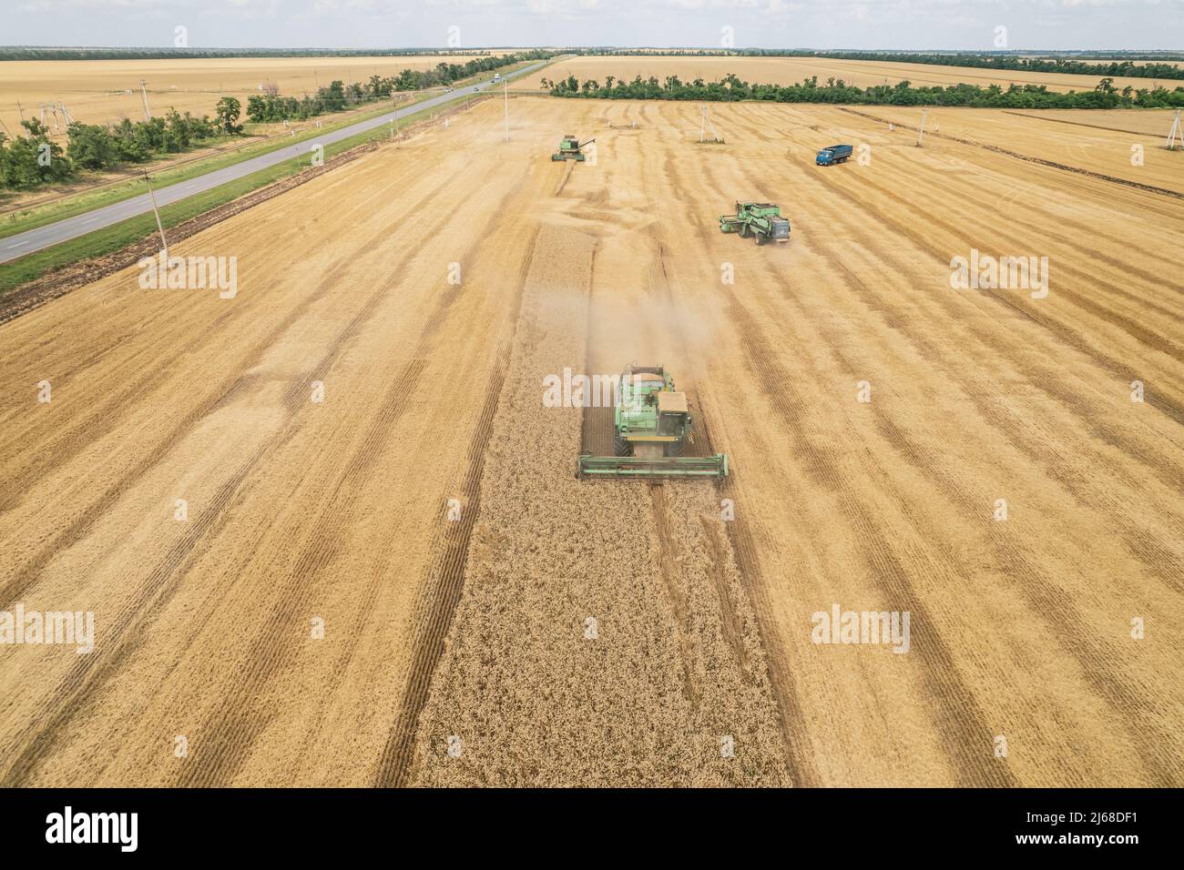 Combine harvesting: aerial view of agricultural machine collecting ...