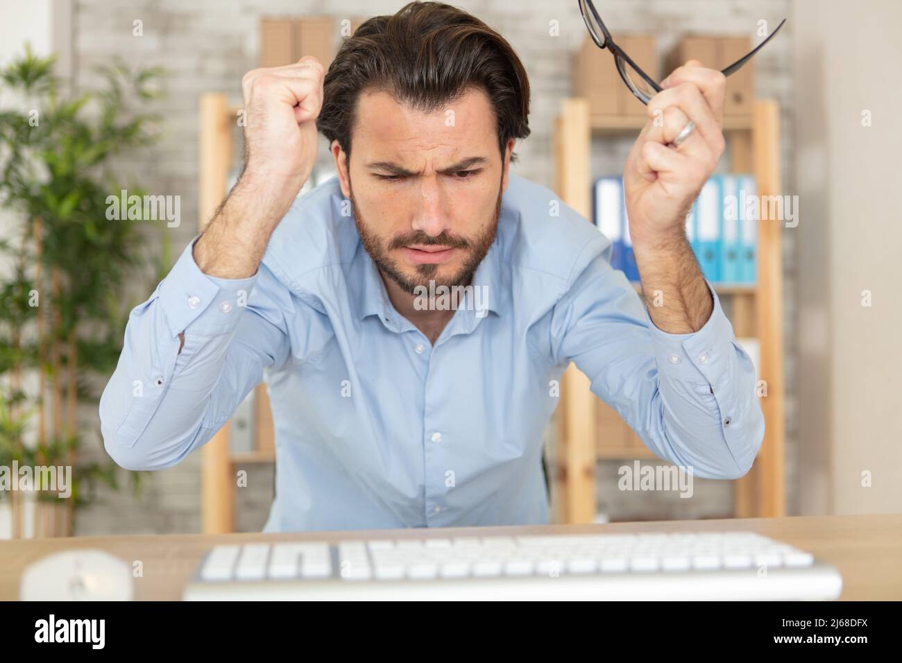 angry clerk in the office shouting Stock Photo - Alamy
