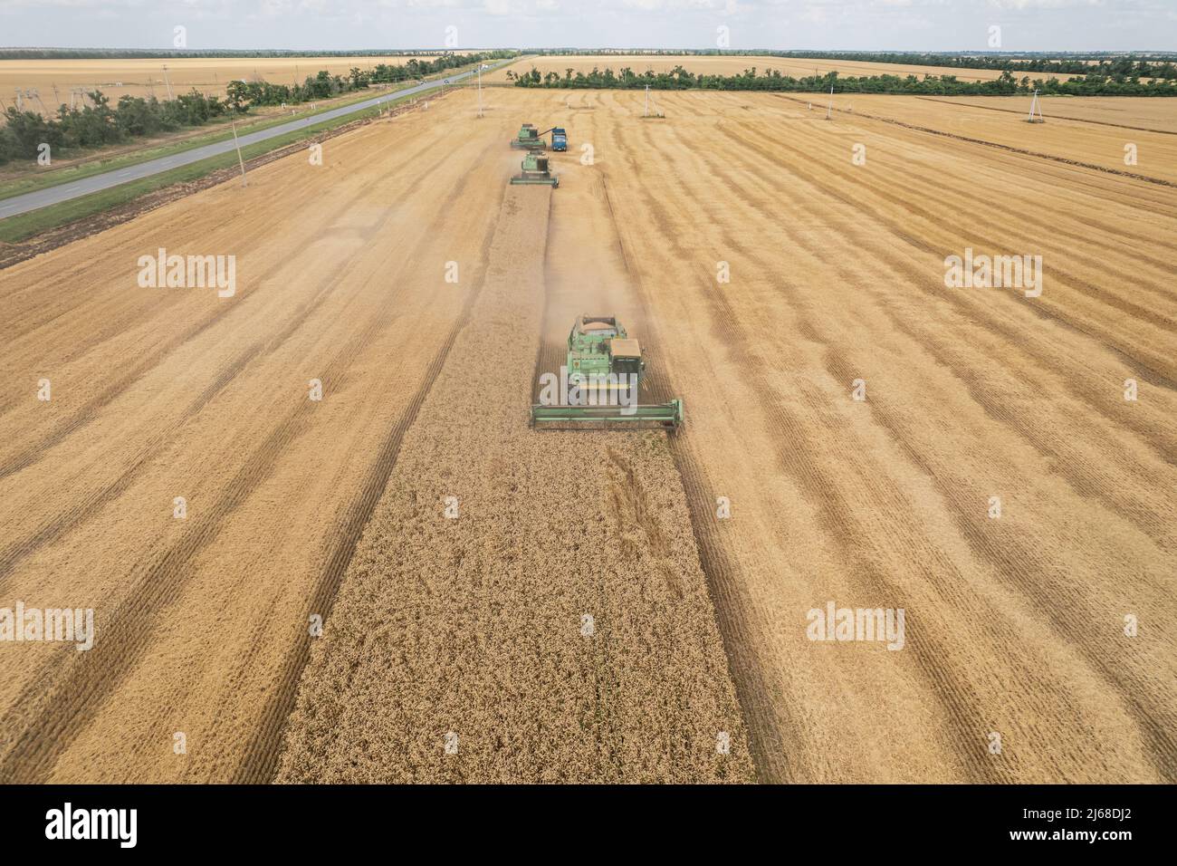 Combine harvesting: aerial view of agricultural machine collecting ...