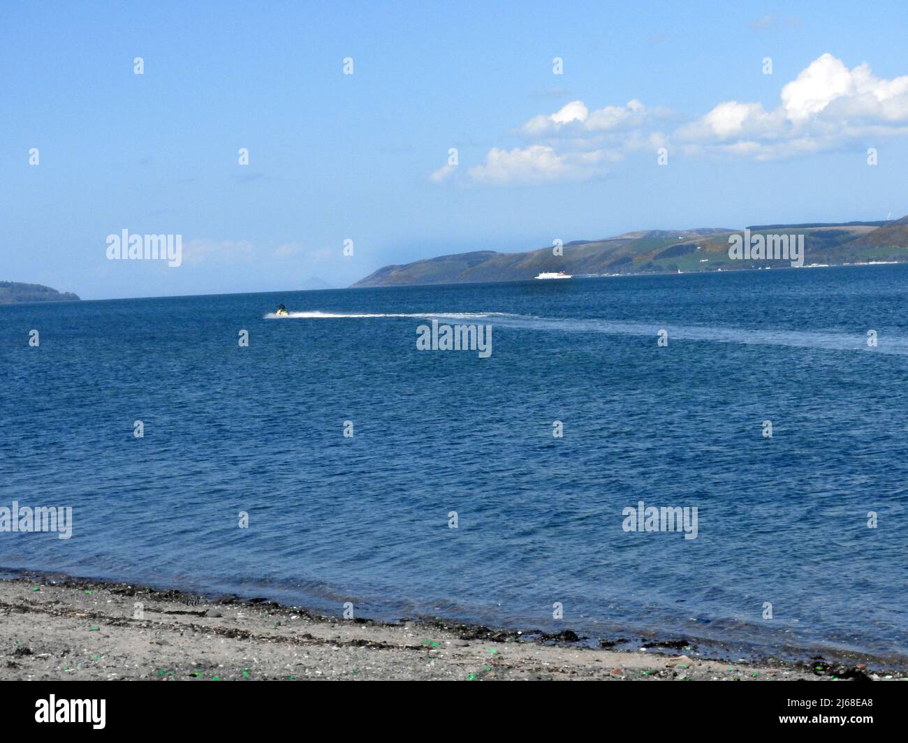 Loch Ryan, a jet skier with Cairnryan ( Machair an Sgithich) and an ...