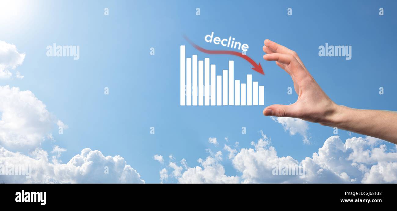 Business man holding holographic graphs and stock.Decline, decrease ...