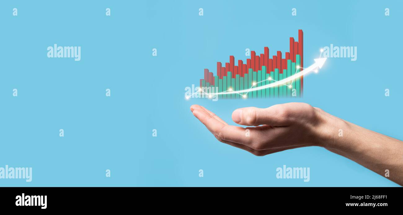 Hand hold drawing on screen growing graph, arrow of positive growth ...
