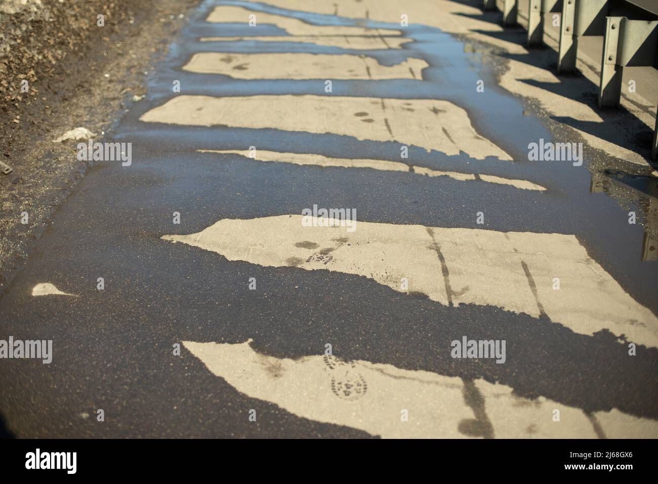 Puddle in road hi-res stock photography and images - Alamy