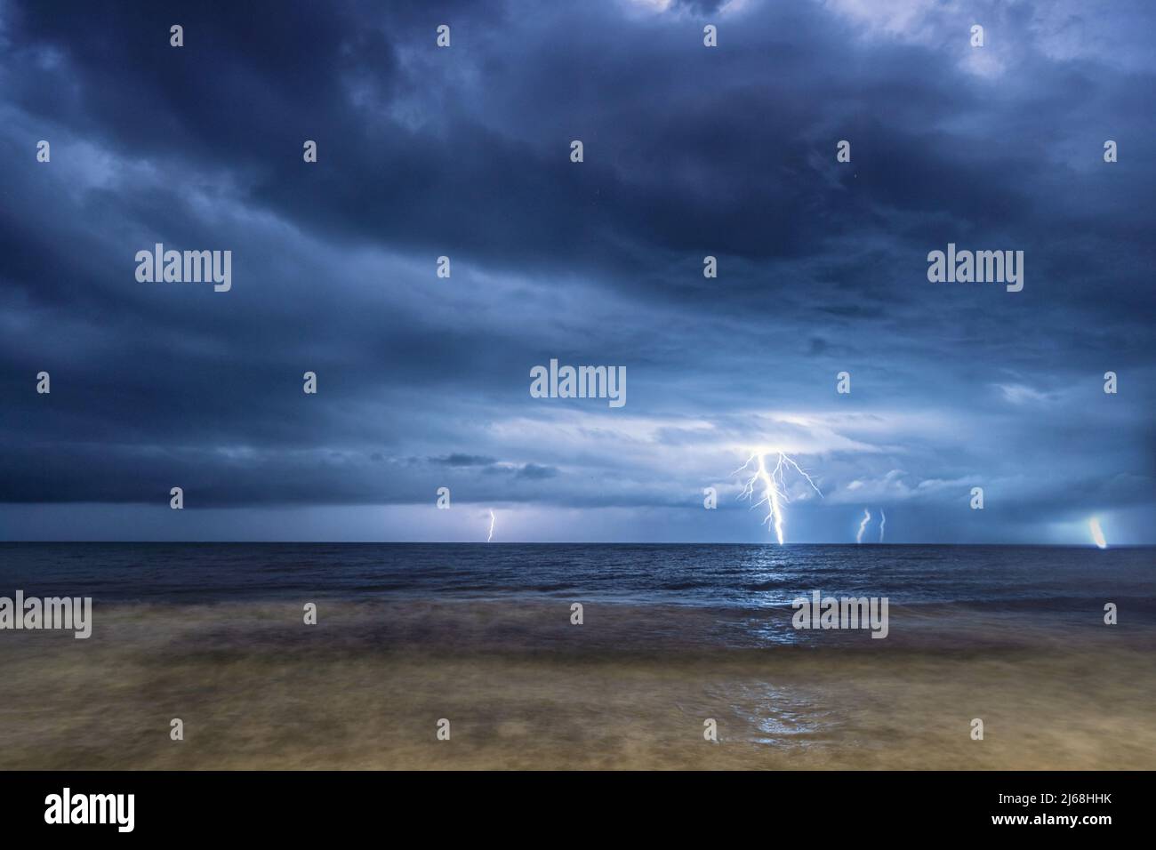 Storm and lightning strike in the sea Stock Photo - Alamy